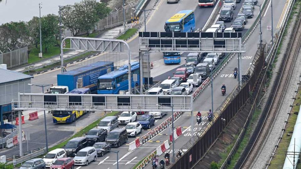 Frustrated cross-border commuters in Malaysia’s Johor Baru forced to ...
